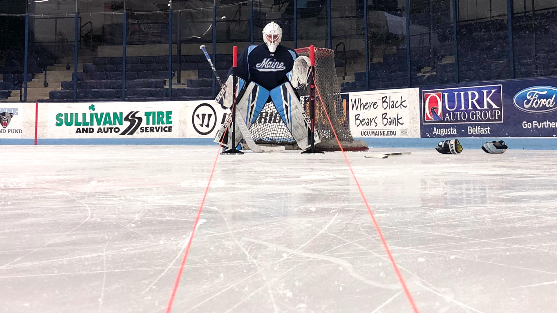 Jeremy Swayman in butterfly stance at the top of his crease during an ...